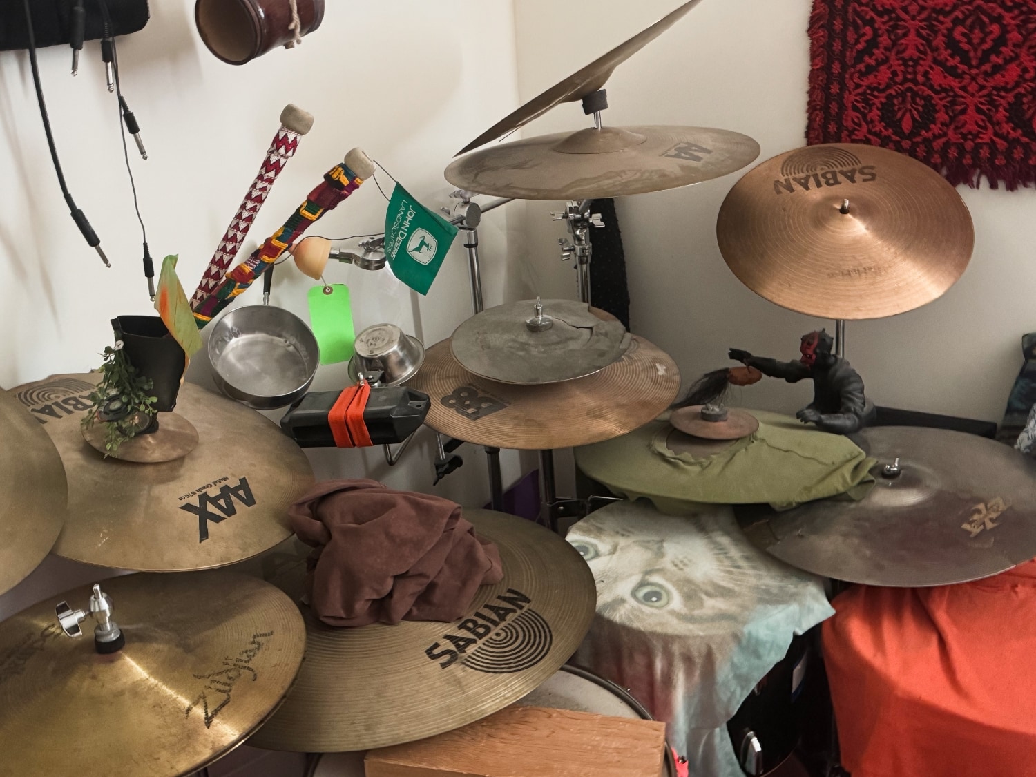 My drum kit, with a dozen-ish weird cymbals. The kit is decorated with ...